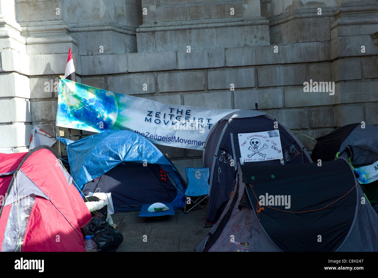 Tents with slogans and banners at the anti Capitalist protest St.Paul's ...