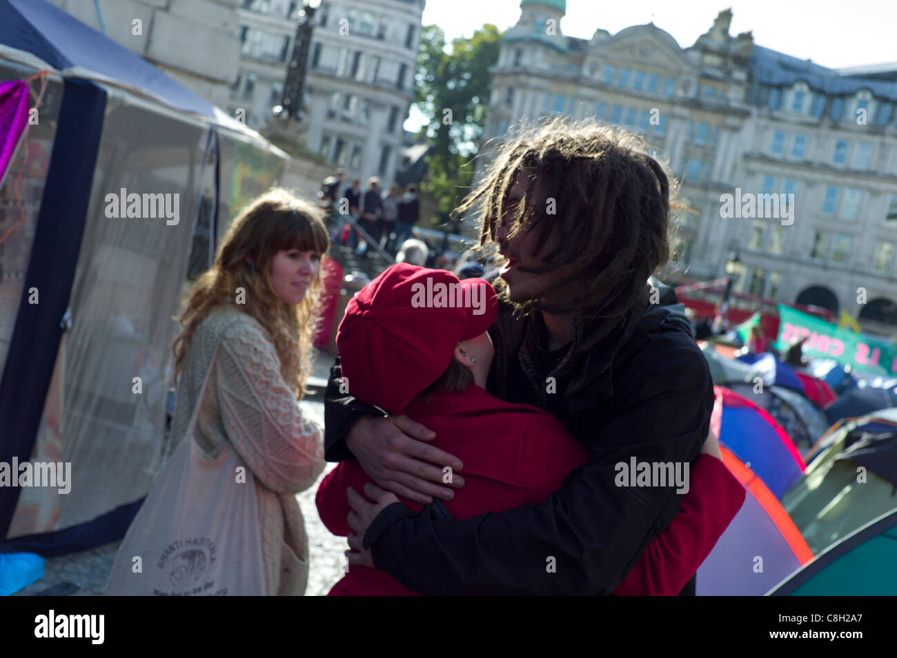 Protesters hugging at the anti Capitalist protest St.Paul's Cathedral ...