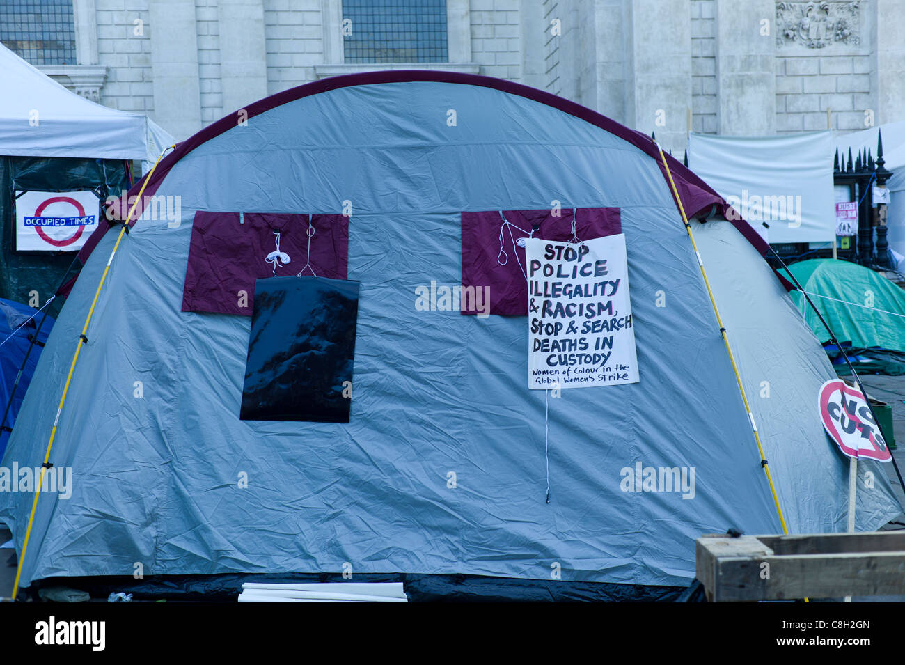 Tents with slogans and banners at the anti Capitalist protest St.Paul's ...