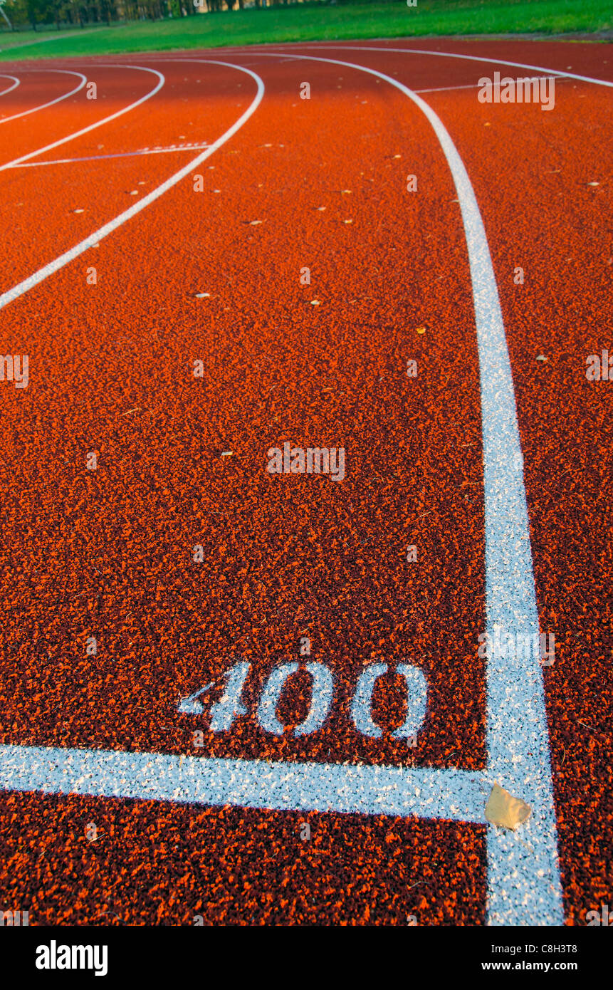 evening light on autumn stadium red track Stock Photo - Alamy
