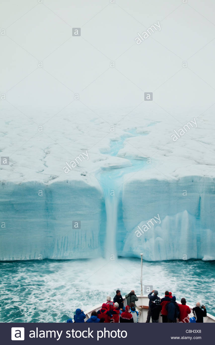 Summer meltwater forms a waterfall on an ice cap Stock Photo - Alamy