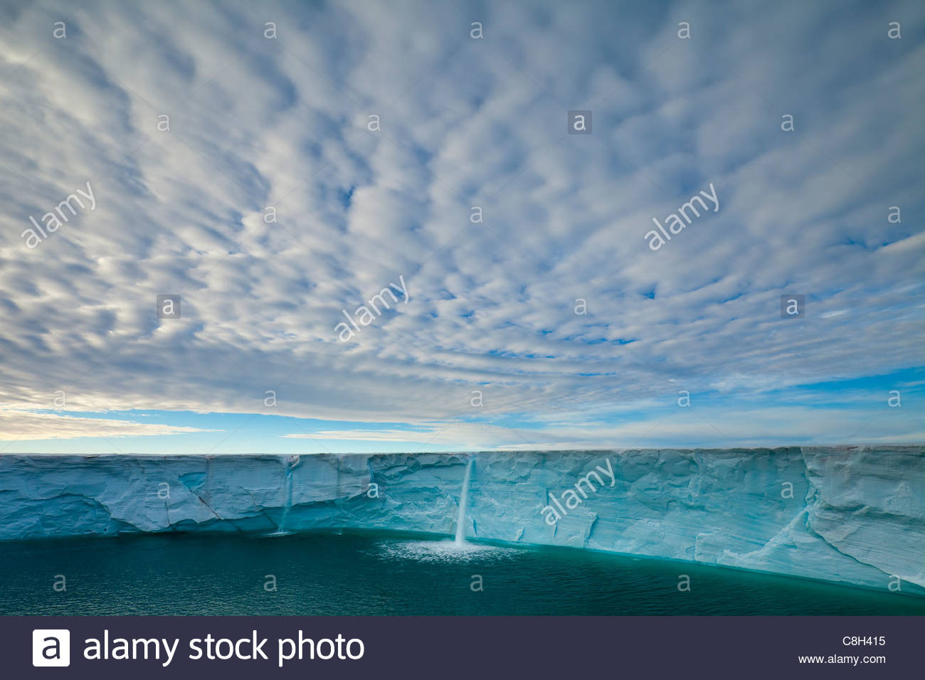 Summer meltwater forms waterfalls on an icecap Stock Photo - Alamy