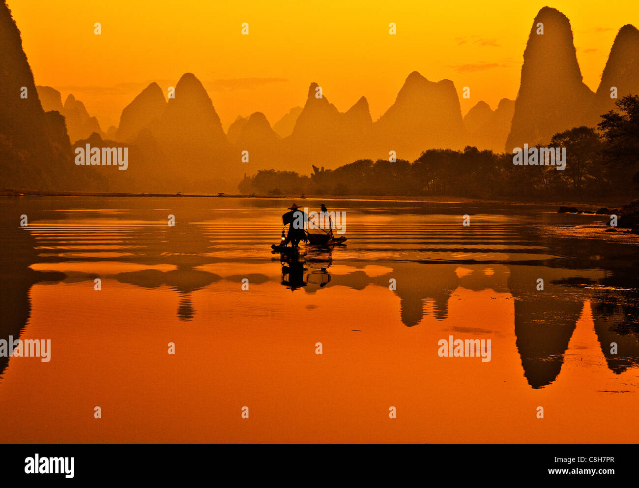 Fisherman on Li River at Dusk Stock Photo - Alamy