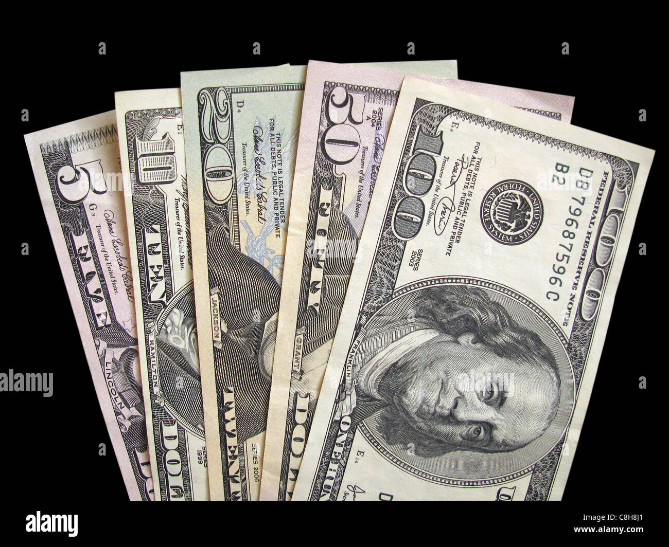 fan-shaped dollars over black Stock Photo - Alamy