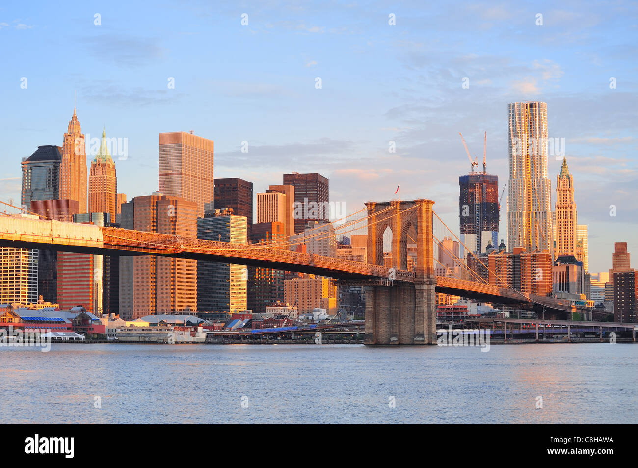 Brooklyn Bridge with lower Manhattan skyline in the morning with ...