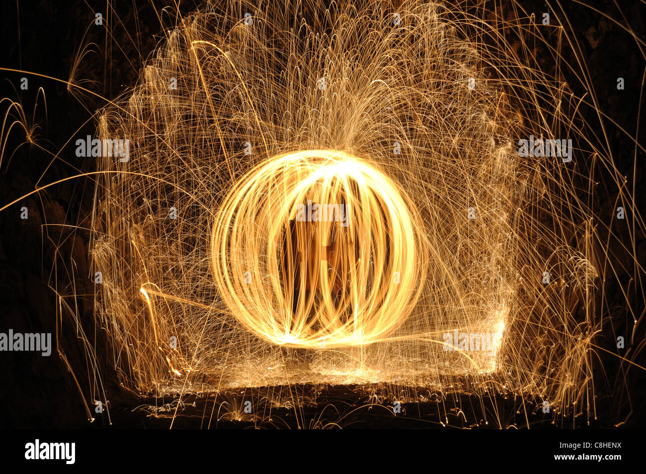 vibrant iron burning sphere in a dark tunnel Stock Photo - Alamy