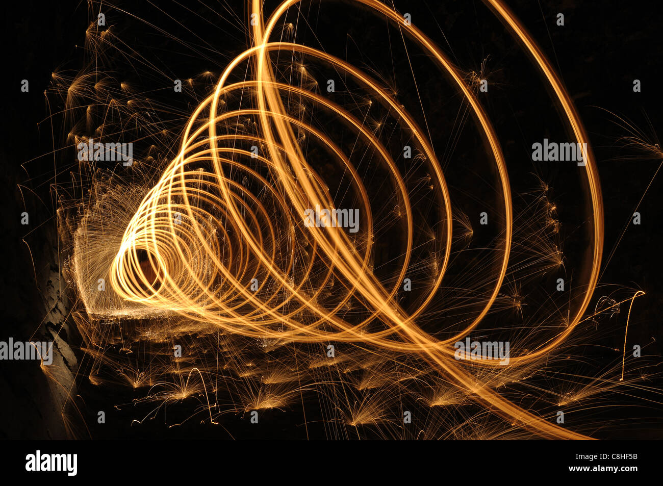 burning iron revolution shape in a dark tunnel Stock Photo - Alamy