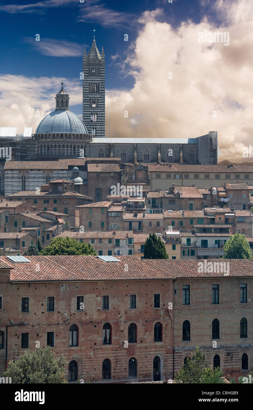 The city of Sienna, with the Duomo profiled against a blue sky, Sienna ...
