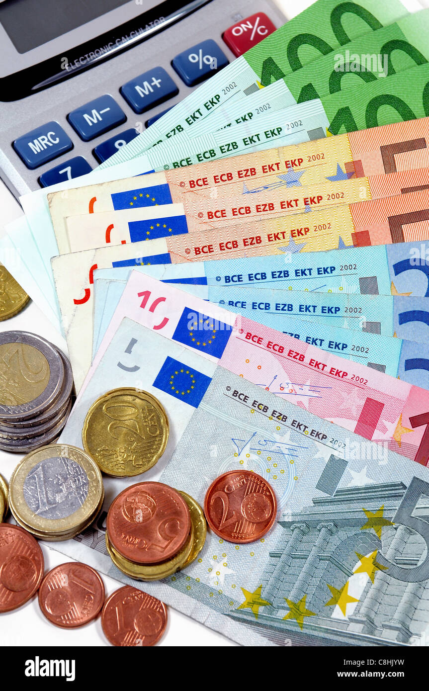 Calculator and Euro currency on white background Stock Photo - Alamy