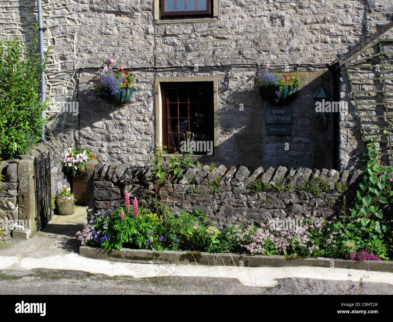 Front of a Stone cottage in the Peak District village of Castleton ...