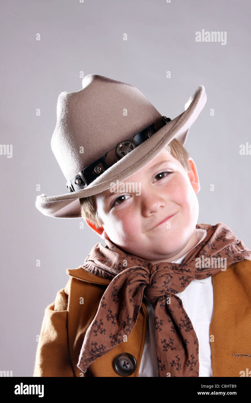 A smiling happy young cowboy with his head tilt Stock Photo - Alamy
