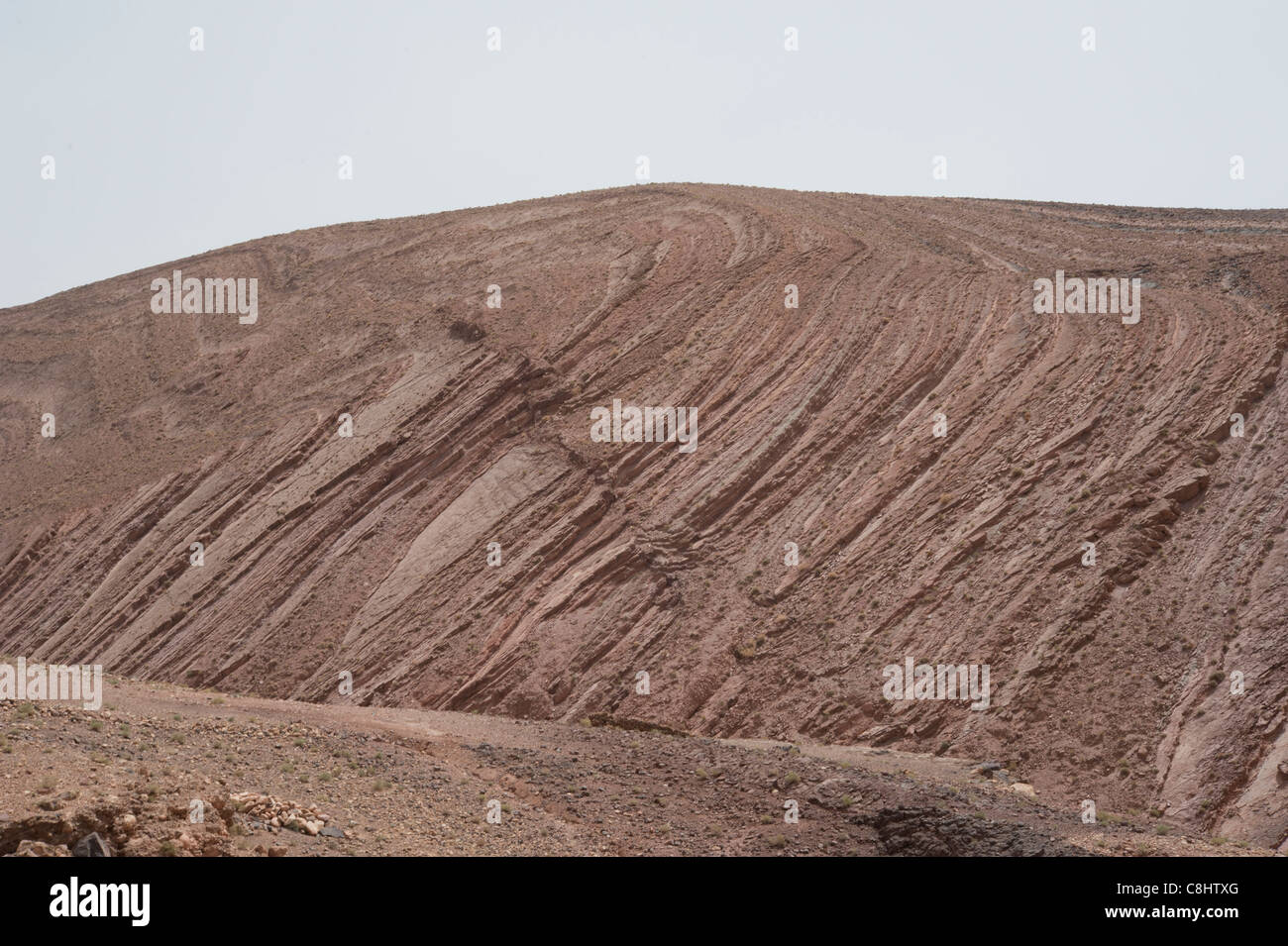 Steeply inclined rock strata in the Saharan desert near Ait Benhaddou ...