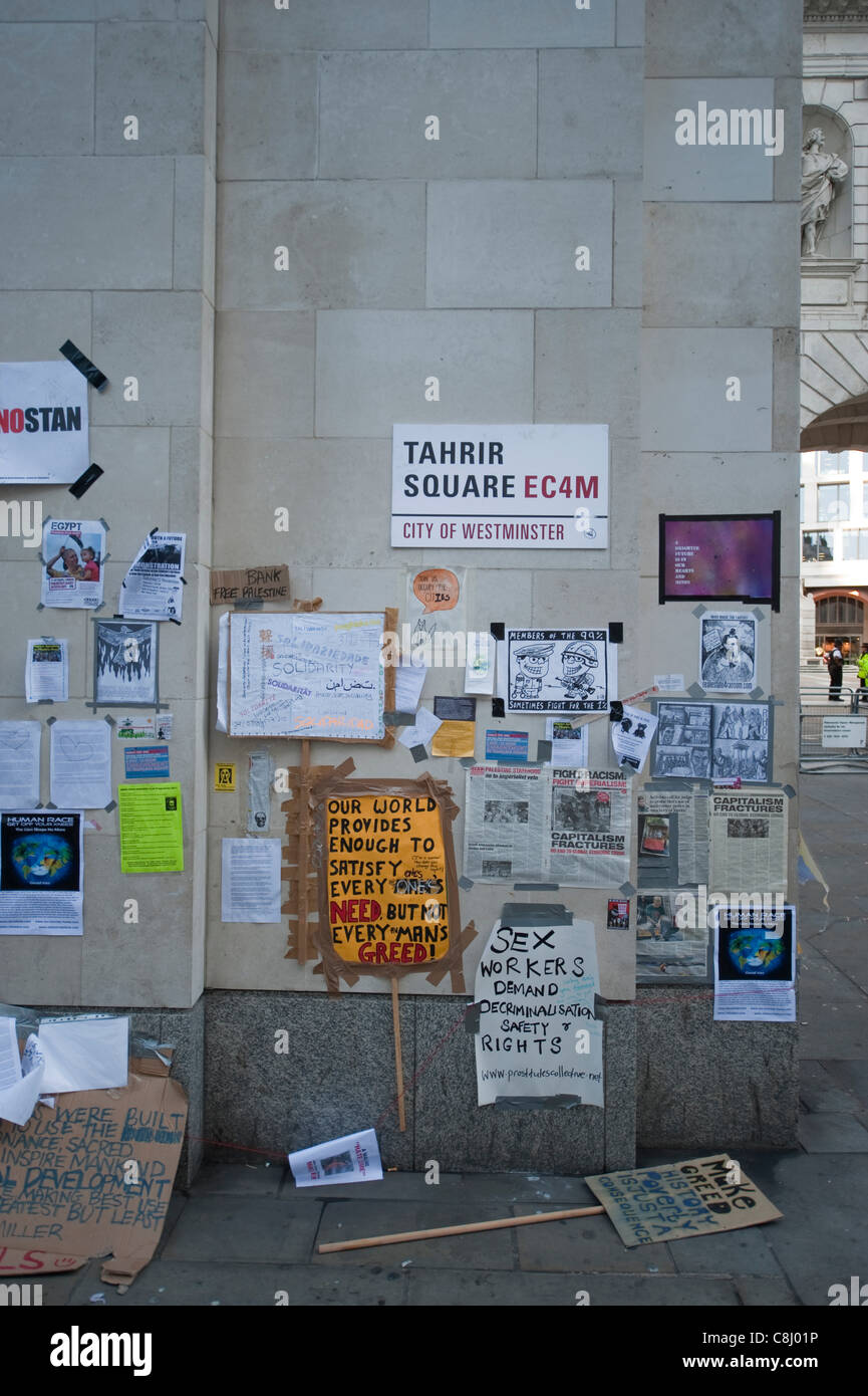 Anti capitalist protest camp posters on wall outside St Paul's ...