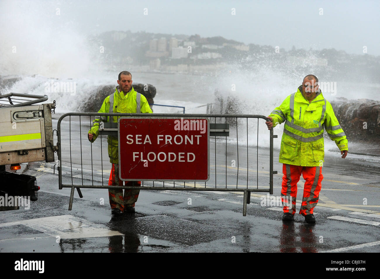 Council workers close torquay sea front due to flooding caused by huge ...