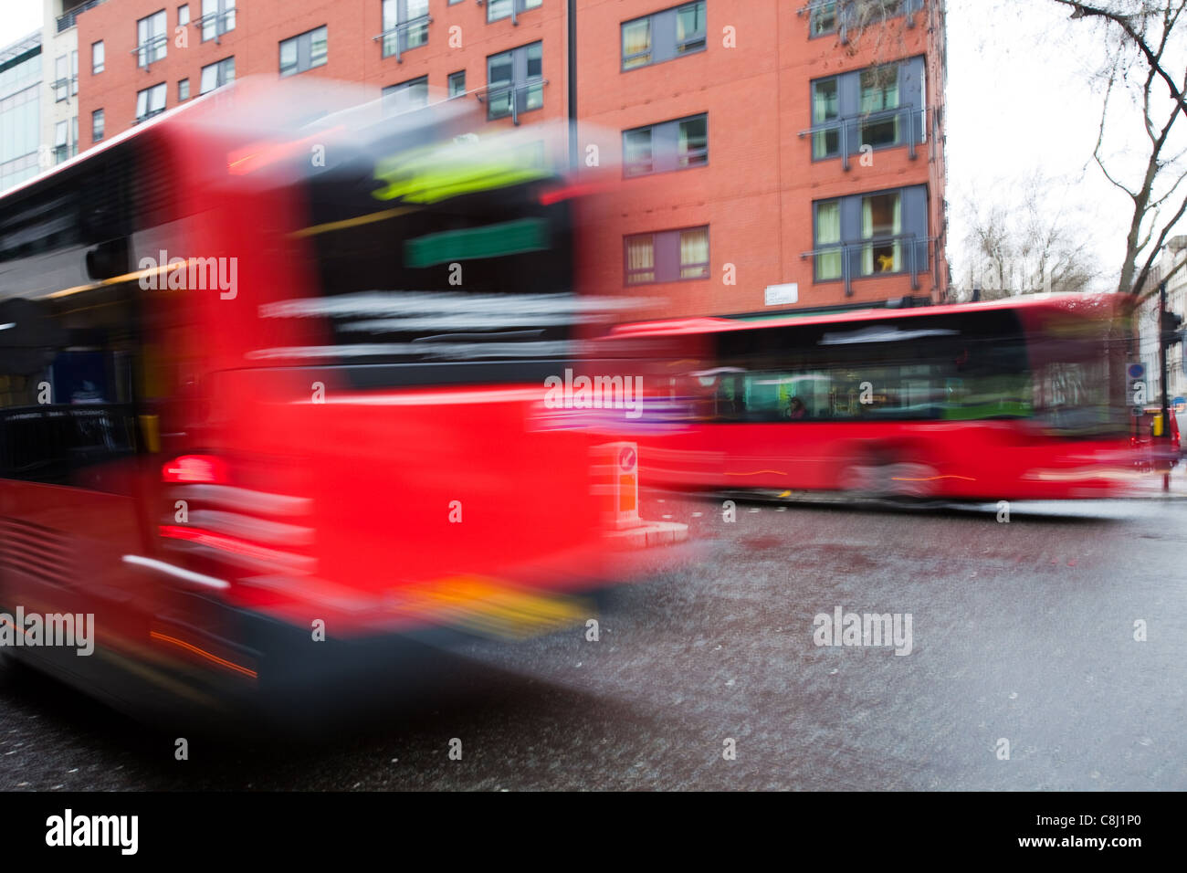 London buses on the move - public transport Stock Photo - Alamy