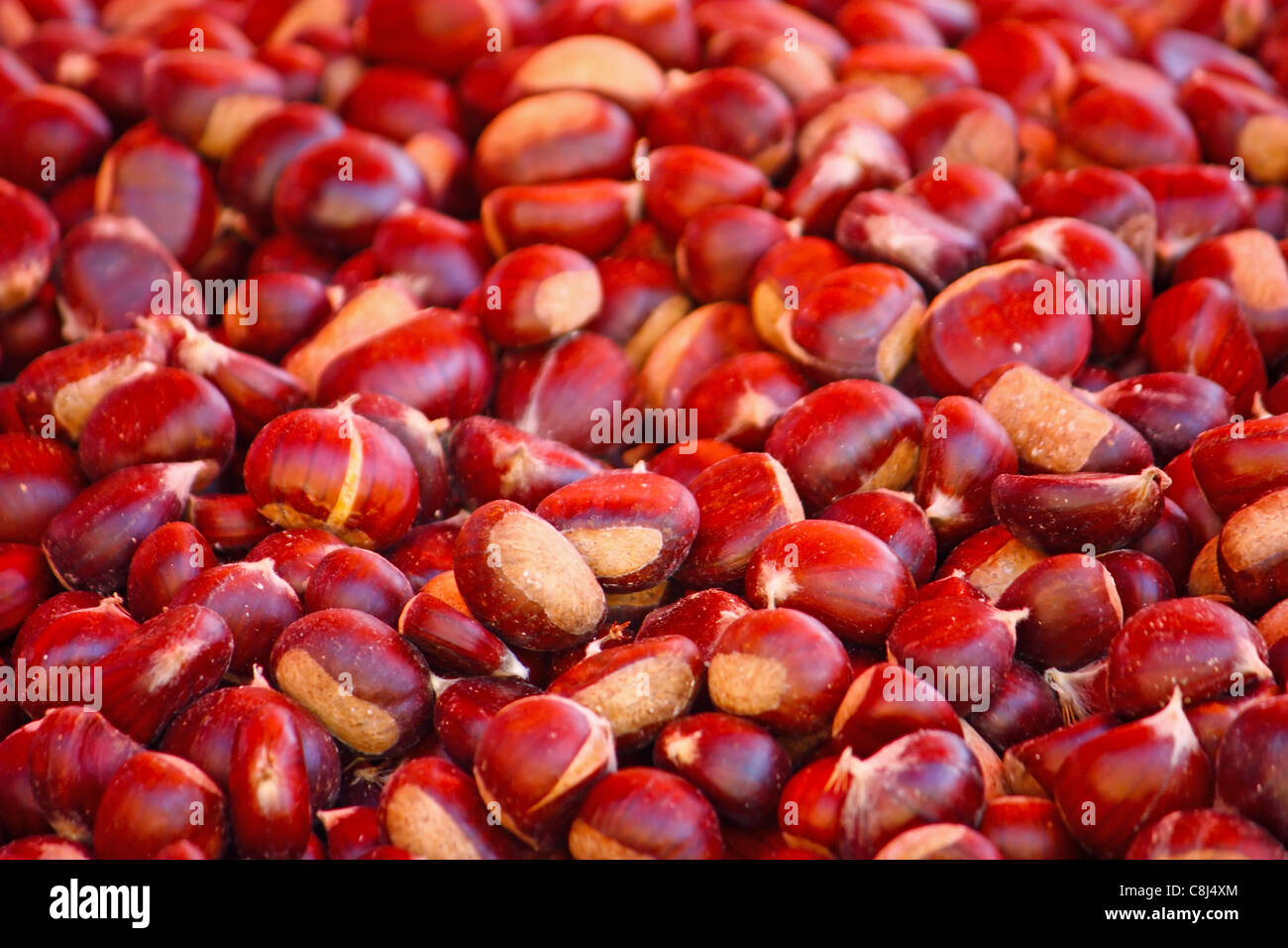 Lots of ripe chestnuts on the market Stock Photo - Alamy