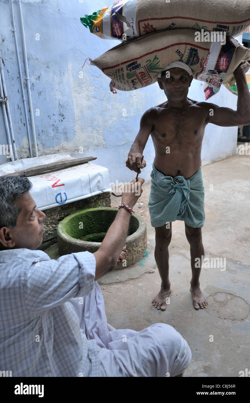 Two men carrying sticks High Resolution Stock Photography and Images ...