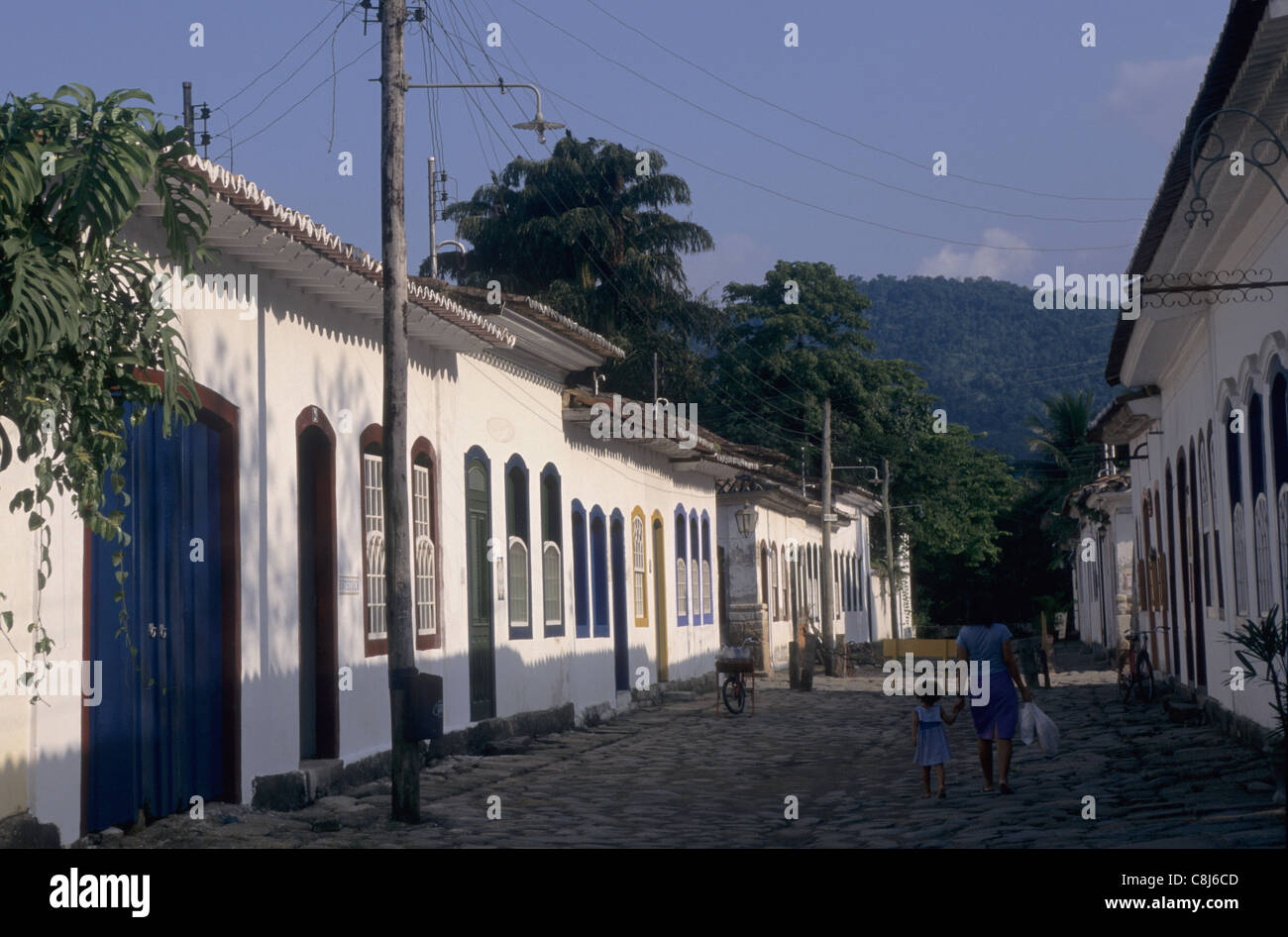 Paraty, Brazil. Colonial buildings in the village with a bicycle and a ...