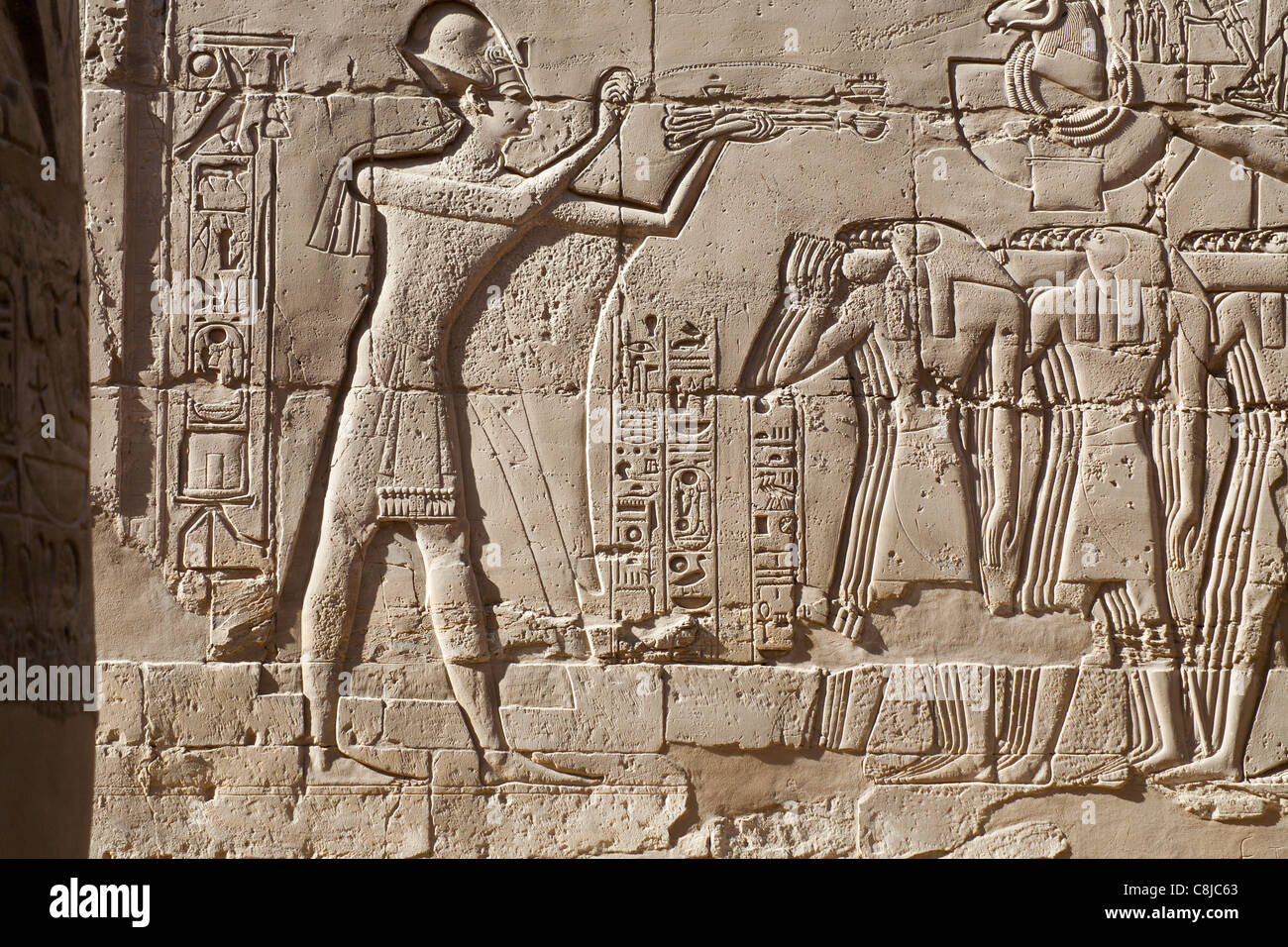 Relief work showing king Seti in blue crown censing the prow of the ...