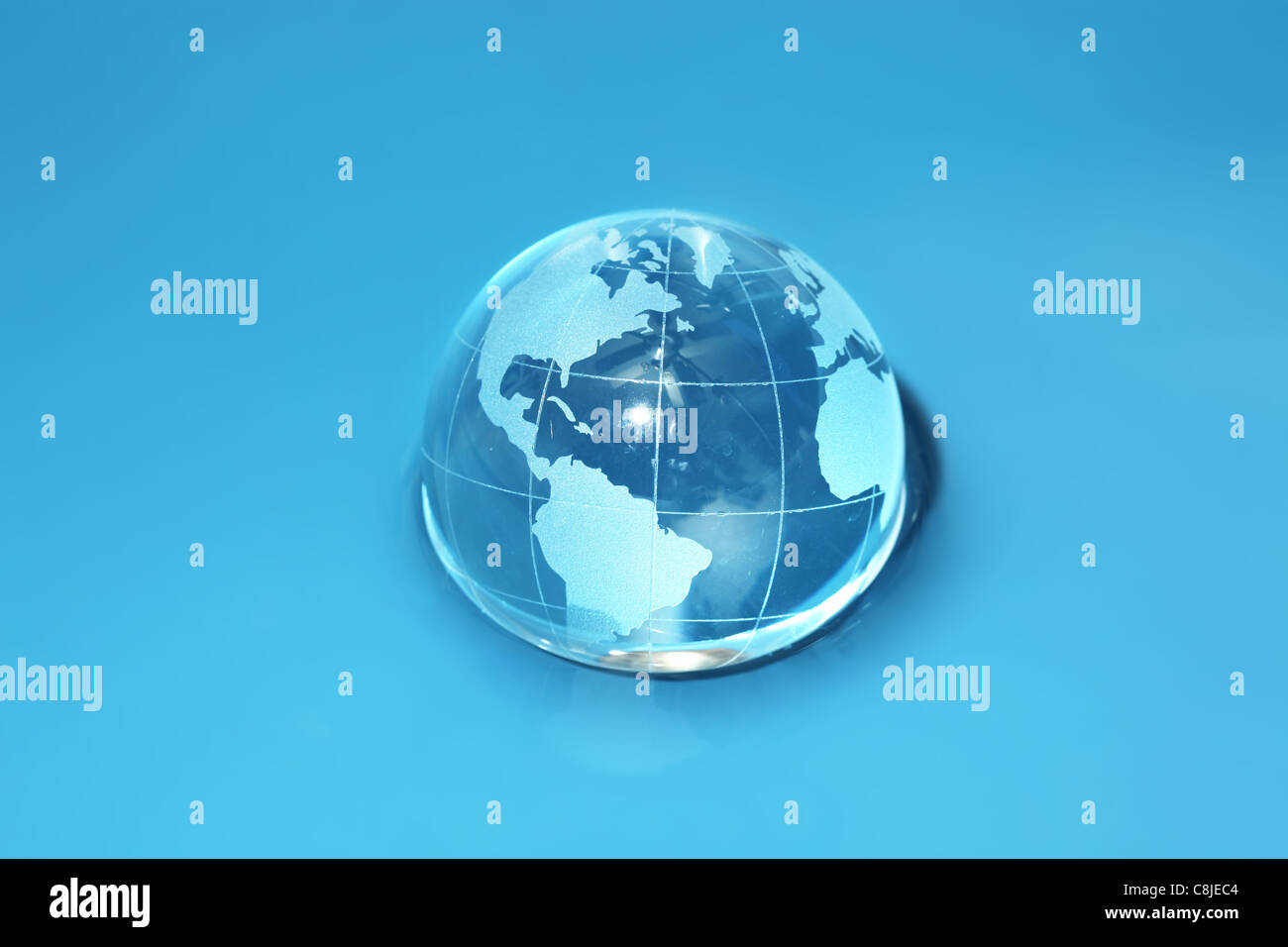 Glass globe in water Stock Photo - Alamy