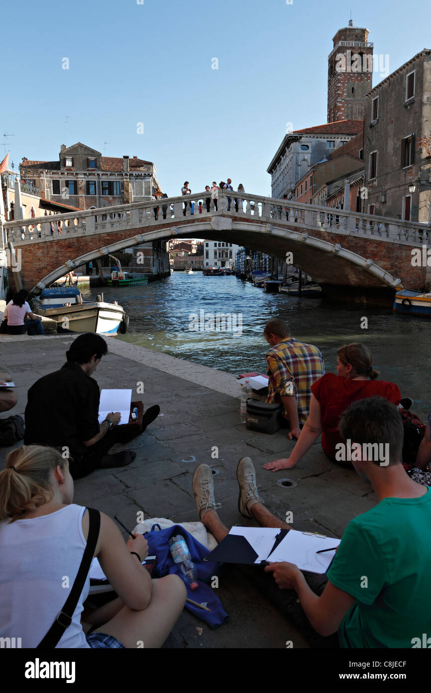 Art students sketching the Canal Cannareggio Bridge , Venice Italy ...