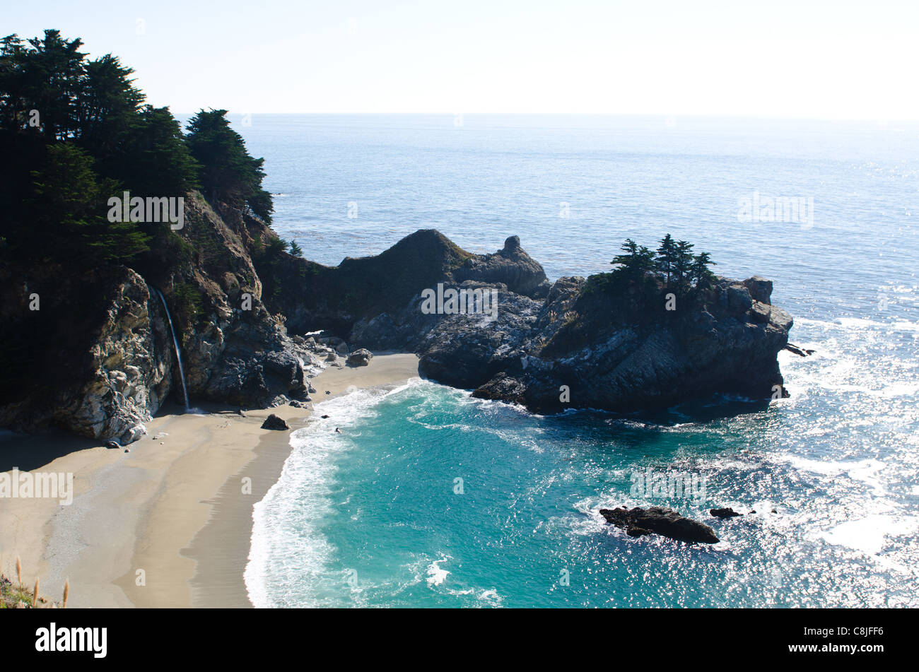 the McWay falls waterfall dropping onto the beach at Big Sur along ...