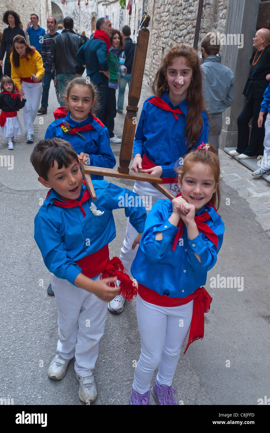 Four young children carry their version of the "stanga" (the H-shaped ...