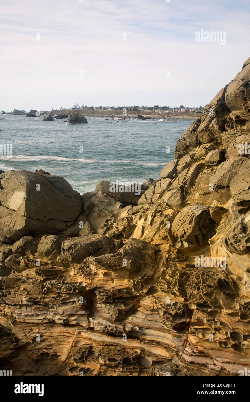 CALIFORNIA - Cliff of weathered and eroded sandstone on a small island ...