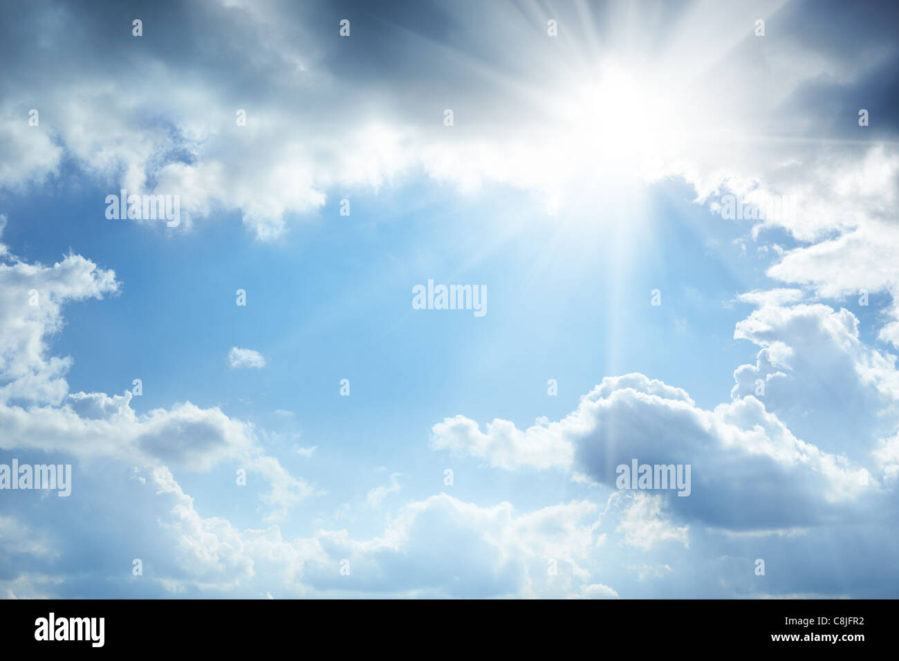Sun and white clouds in the sky Stock Photo - Alamy