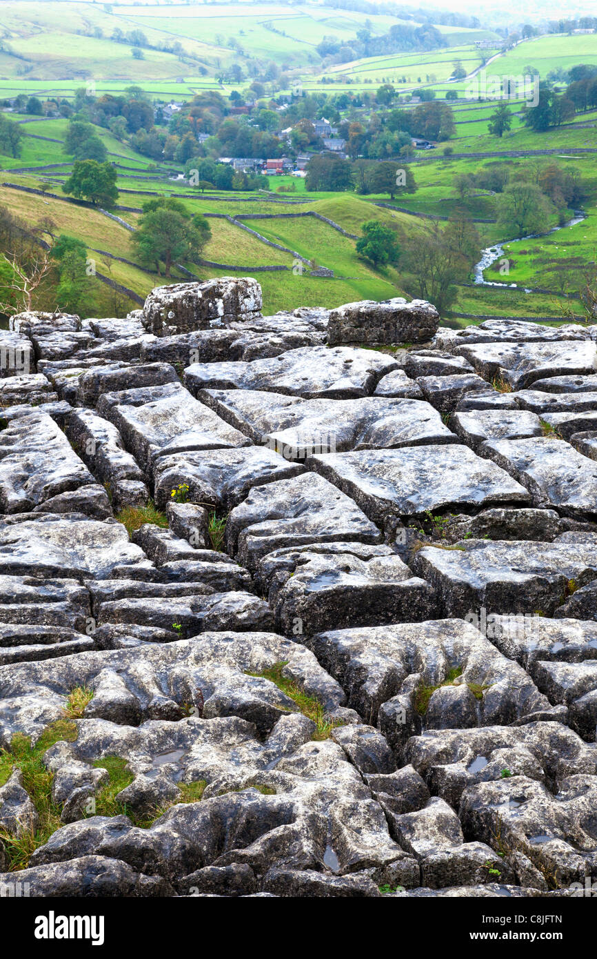 Limestone Pavement at Malham Cove with Village of Malham in Background ...
