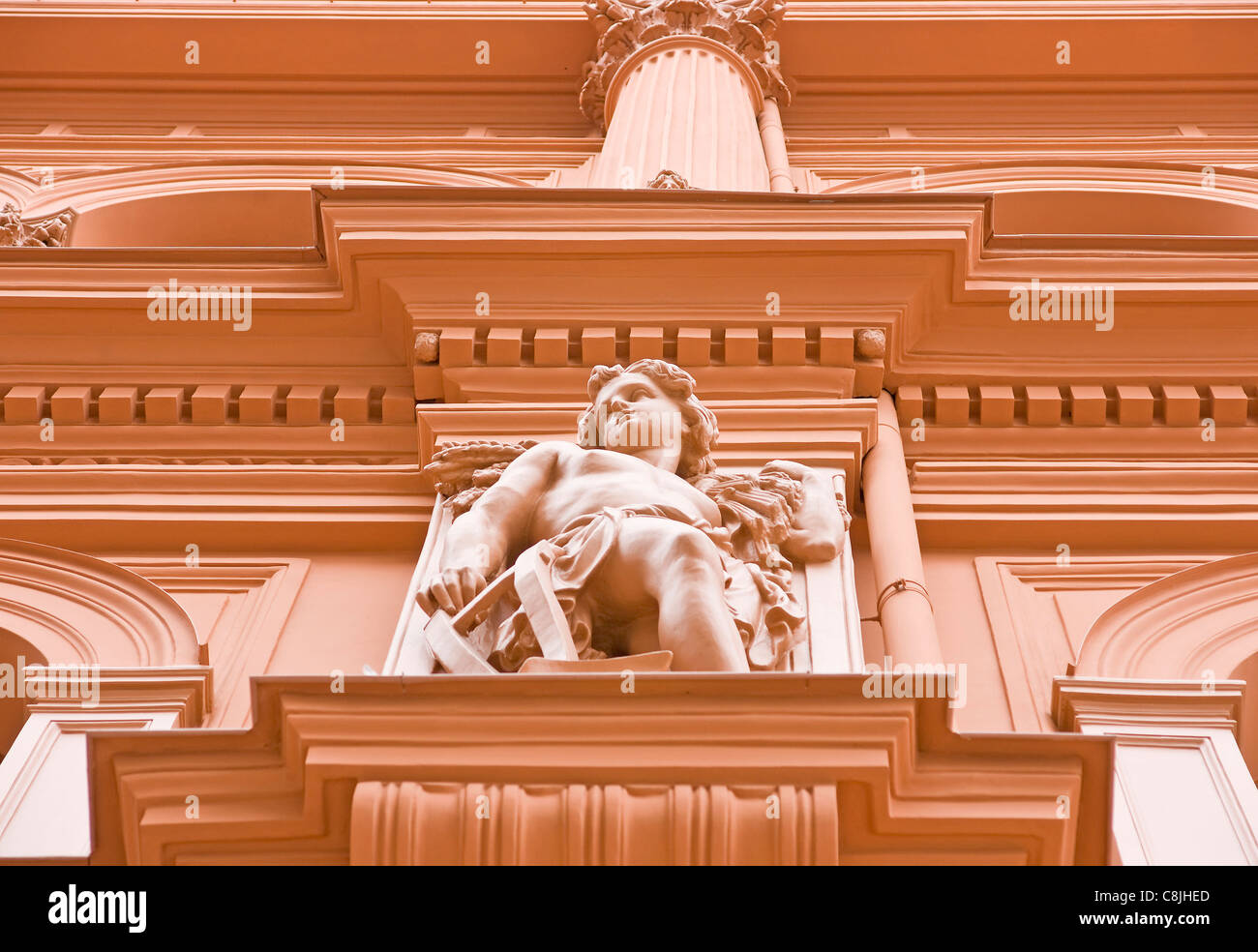 Statue on latvian house wall Stock Photo - Alamy