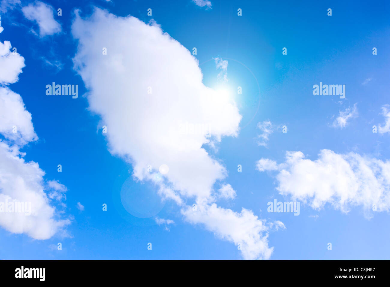 White clouds with sun Stock Photo - Alamy