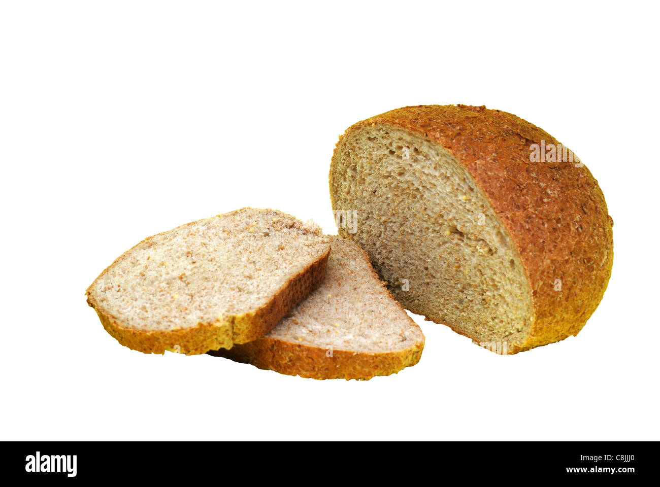 Small round loaf of brown granary bread with two slices on white ...