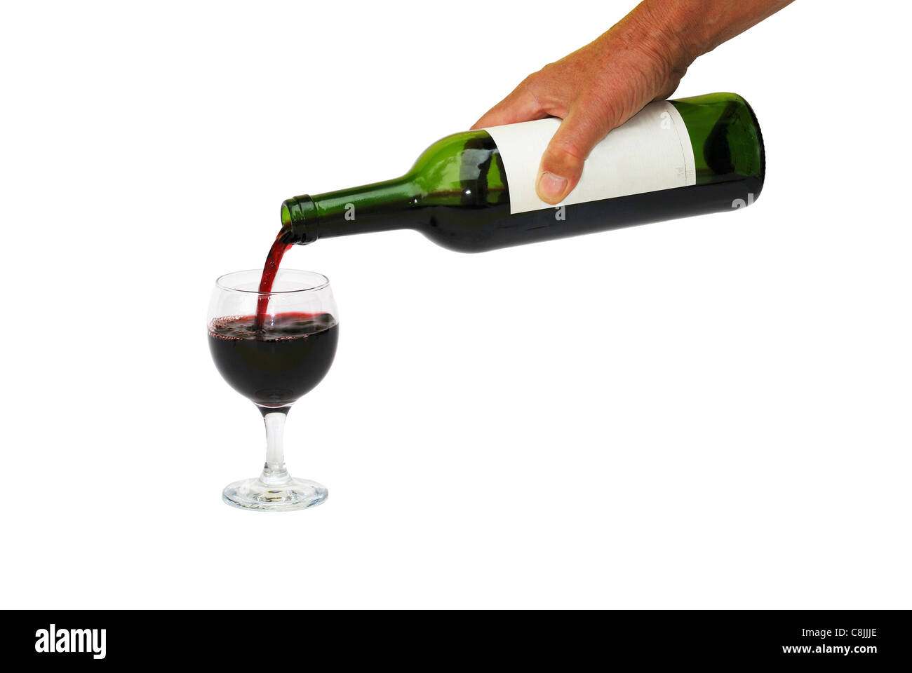 Male hand holding bottle of red wine and pouring into a wineglass Stock ...