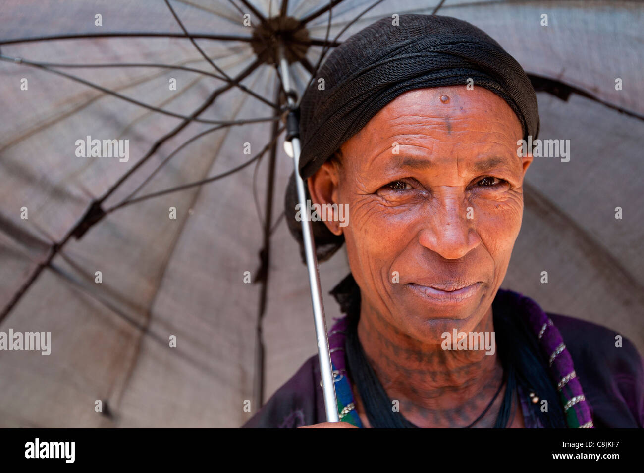 Portrait of a local trader at Usketna market on the mountain road ...