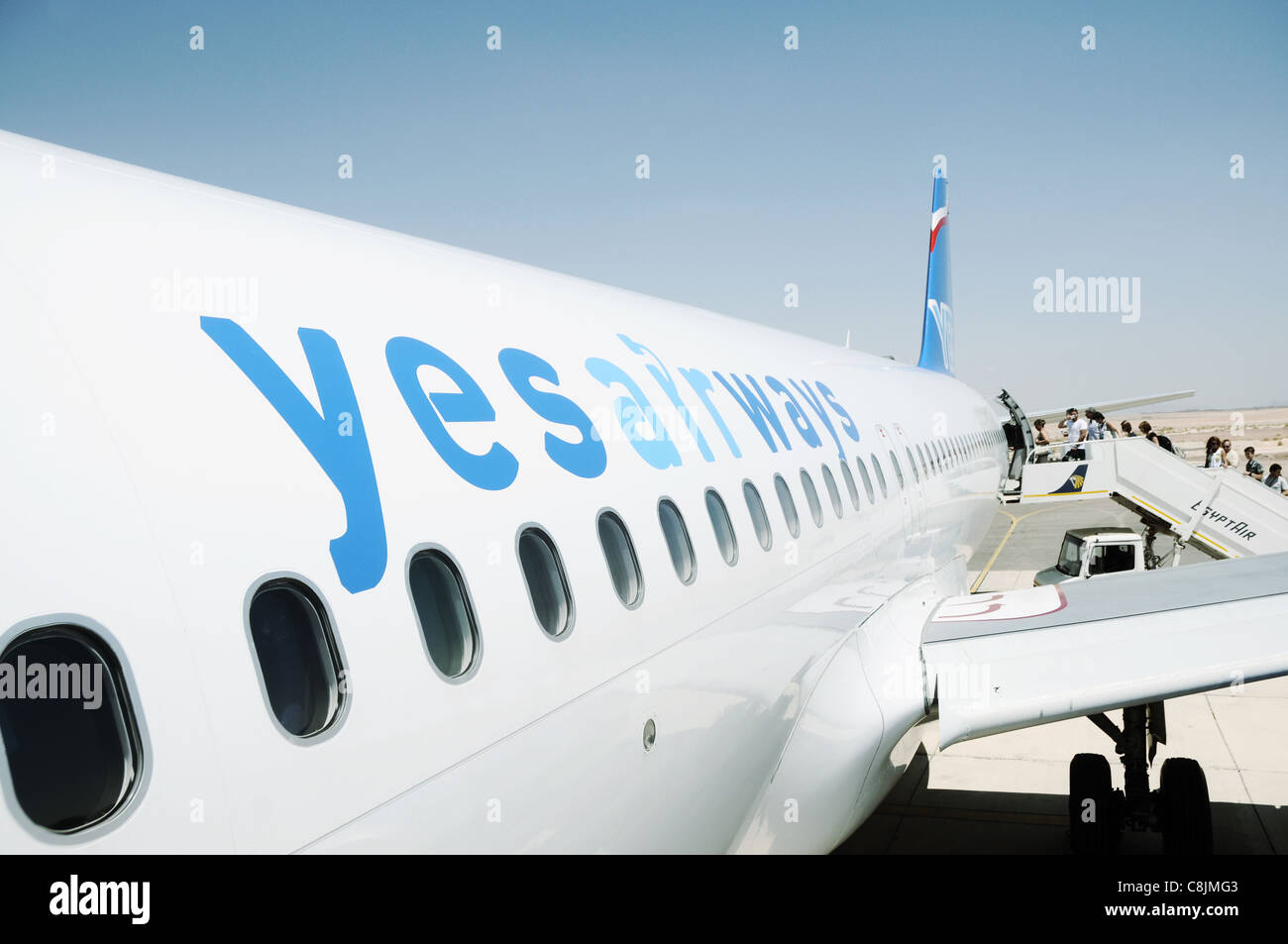 Tourists boarding to polish YES Airways charter airline Airbus 320-200 ...