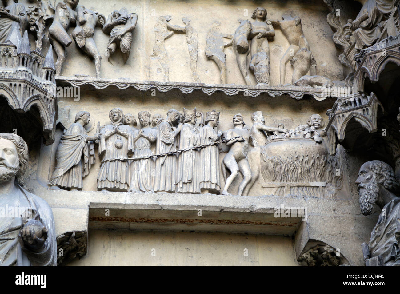 Carving of people being taken to hell on the exterior of reims ...