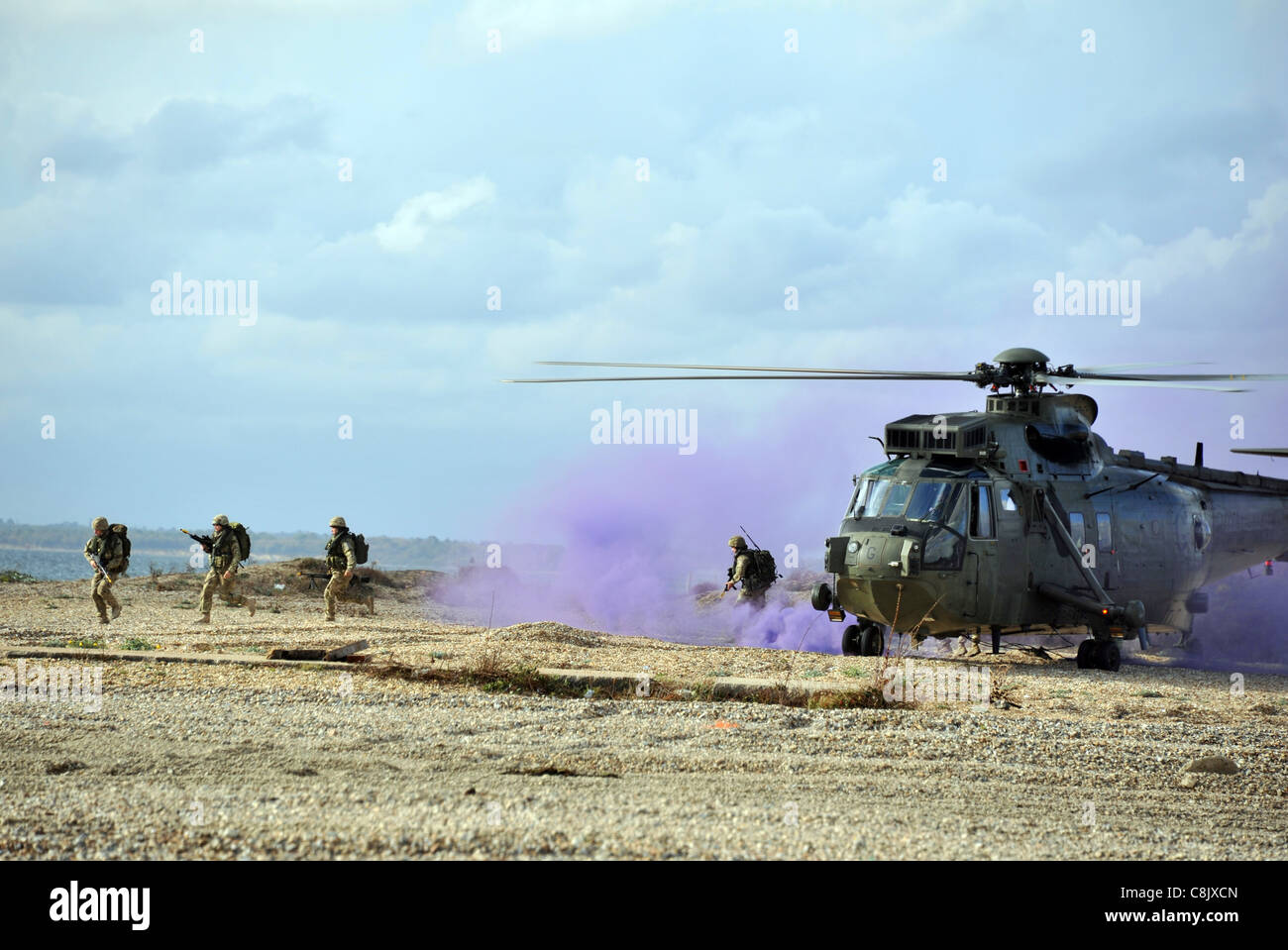 Royal Marines beach assault. Sea King helicopter and troops during ...