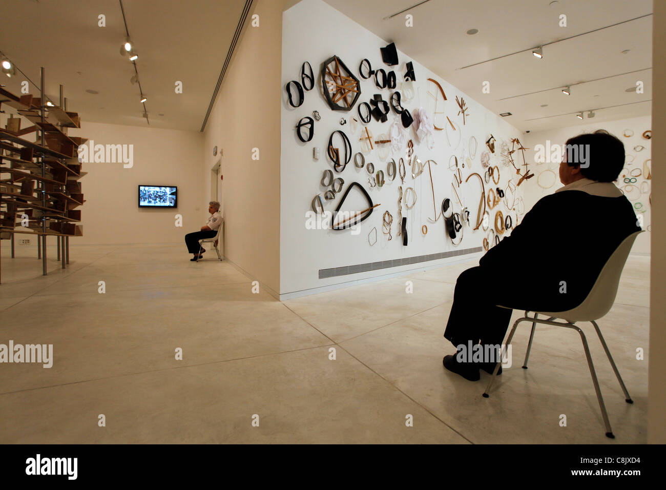 Museum guards sit at a contemporary artwork showroom at the new Herta ...