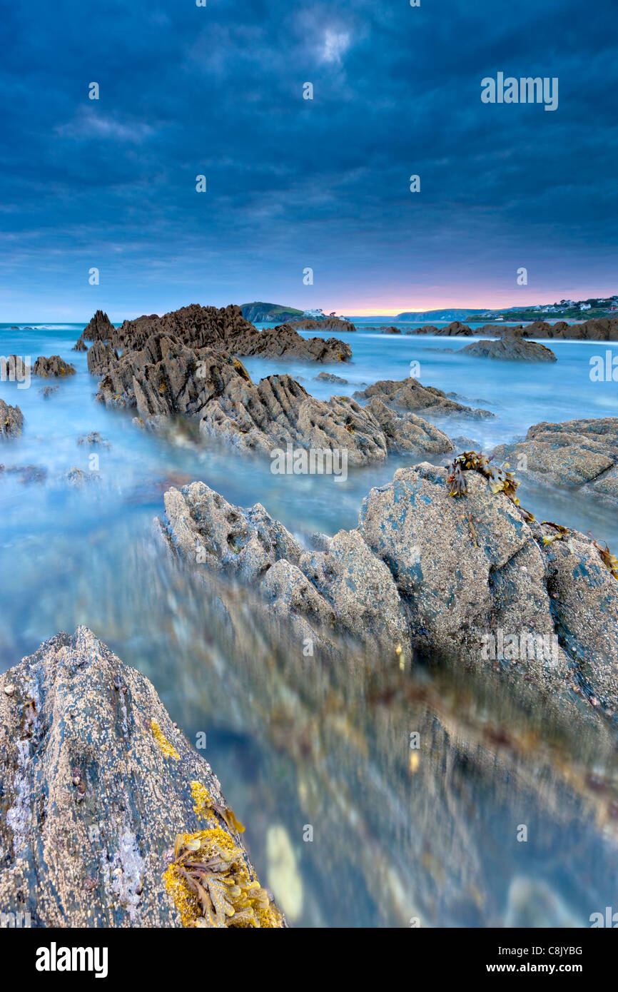 Rocky shores of Bantham at Dusk, Bantham, South Devon, England, United ...