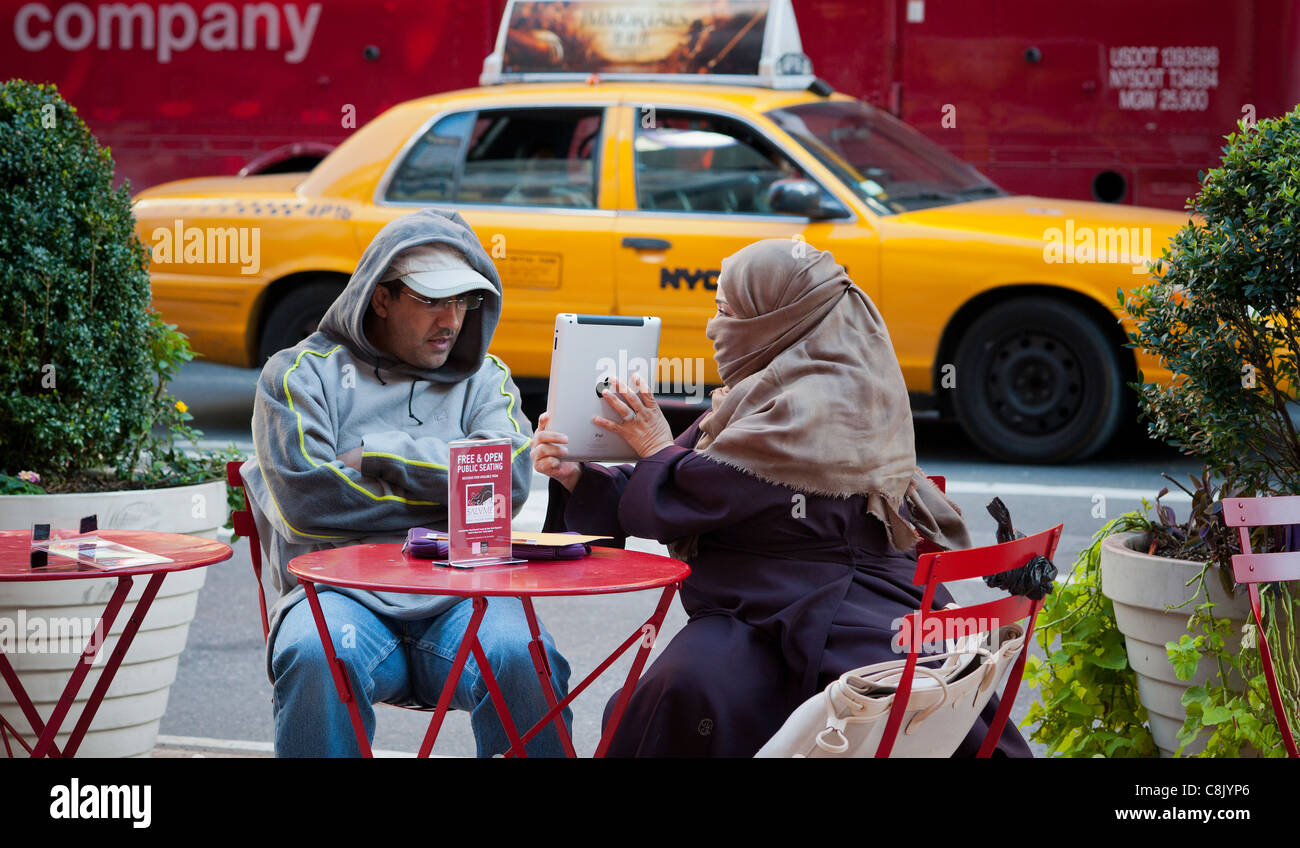 A couple uses their Apple iPad in Times Square in New York on Tuesday ...