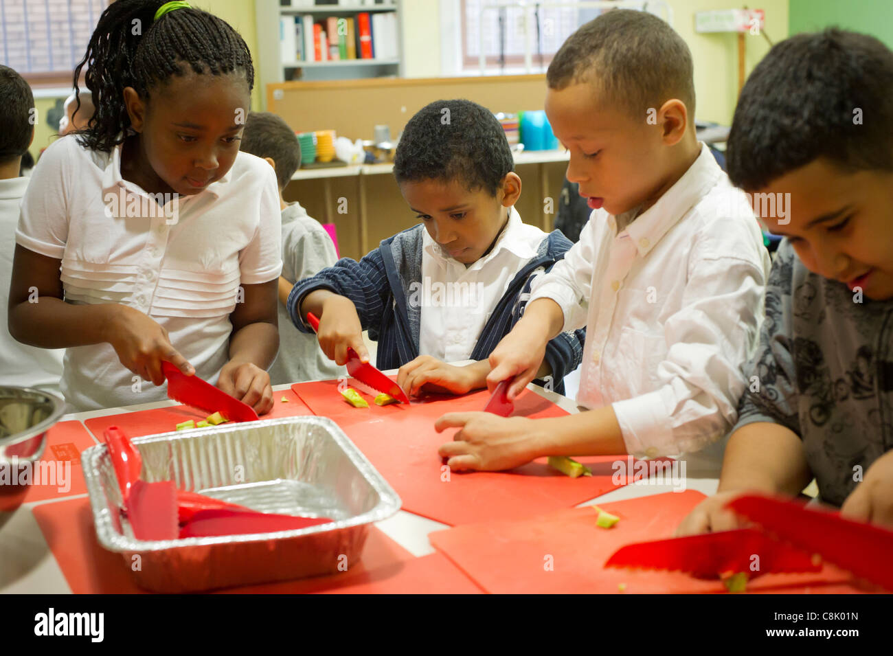 Second and third graders participate in a Plant Part Pizza cooking ...