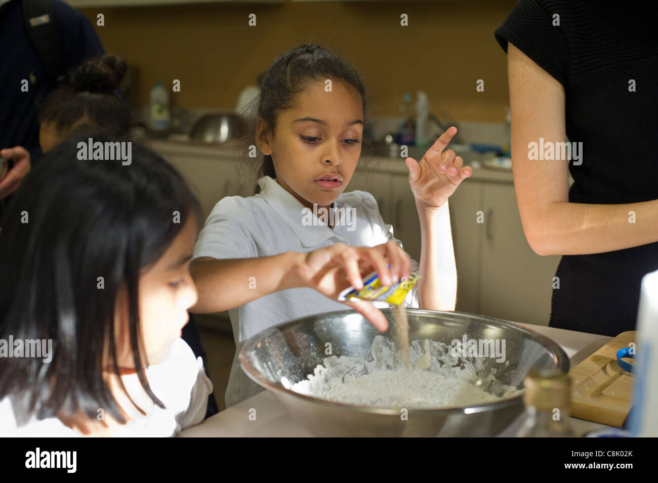 Second and third graders participate in a Plant Part Pizza cooking ...