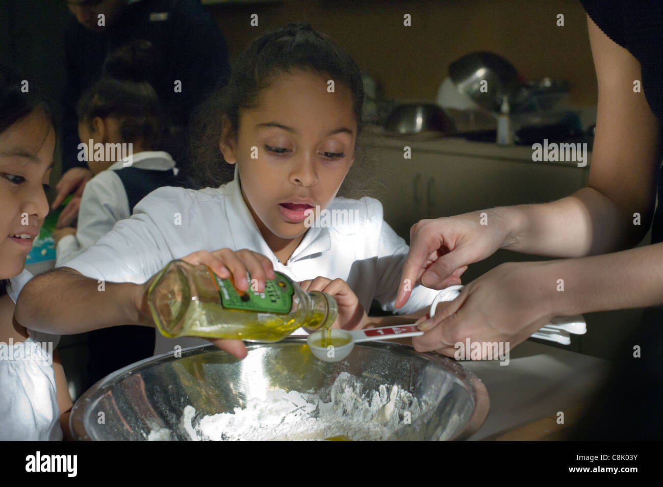 Second and third graders participate in a Plant Part Pizza cooking ...