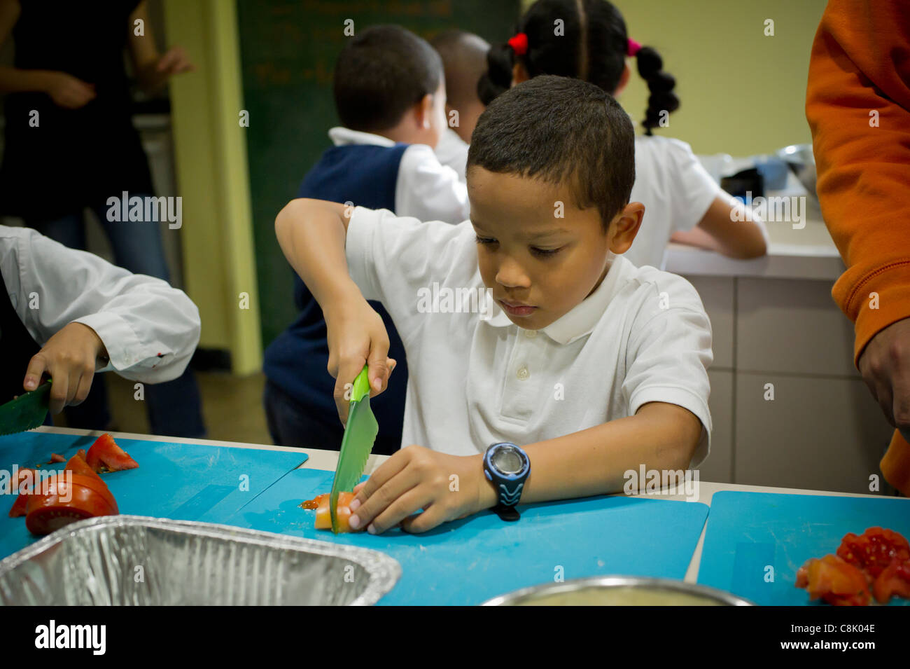 Second and third graders participate in a Plant Part Pizza cooking ...
