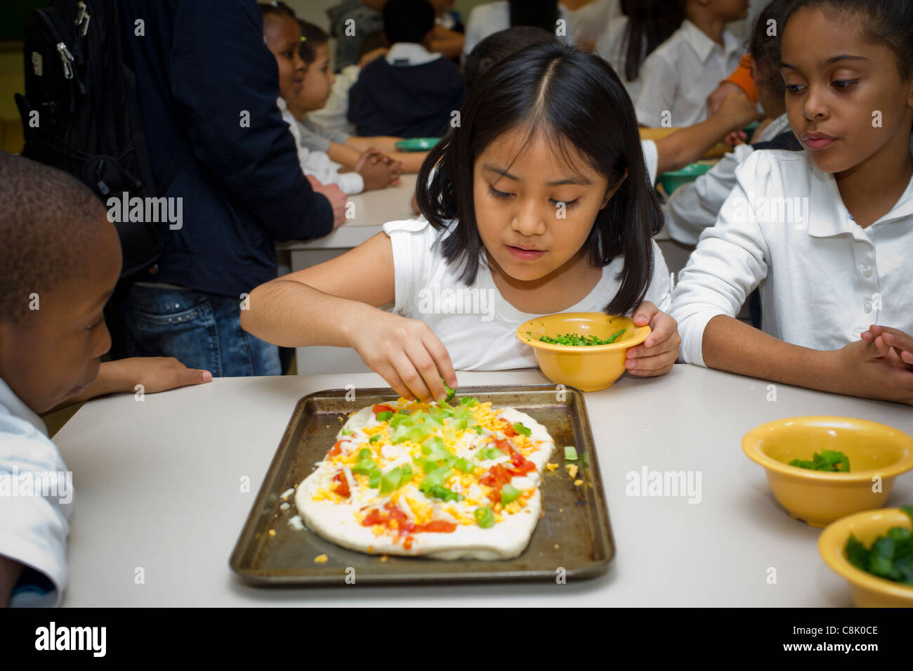 Second and third graders participate in a Plant Part Pizza cooking ...