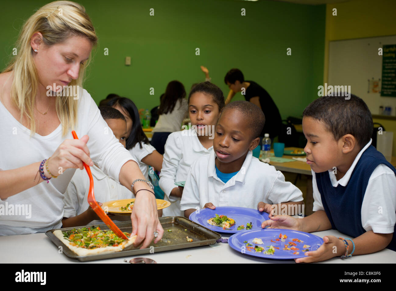 Second and third graders participate in a Plant Part Pizza cooking ...