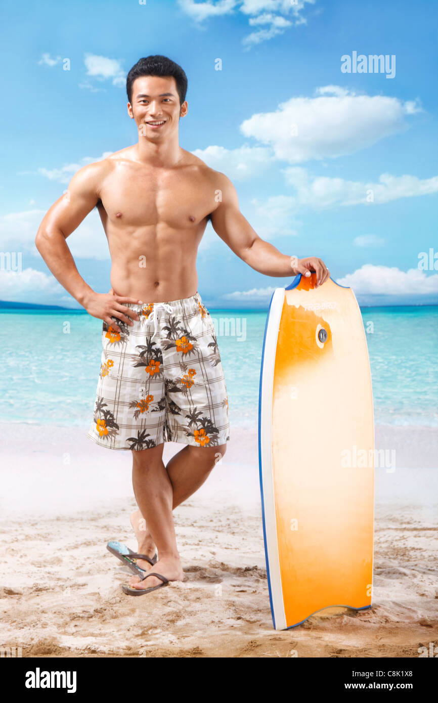 Man on beach Stock Photo - Alamy