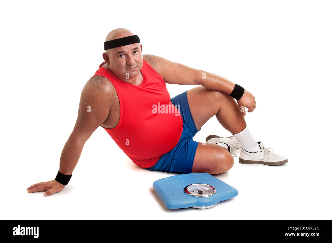 Large fitness man with weight scale isolated in white Stock Photo - Alamy
