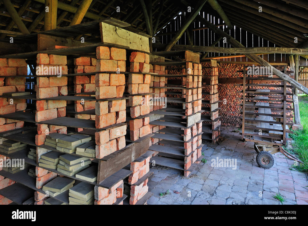 Drying yard with bricks and tiles in shelves at brickworks, Boom ...
